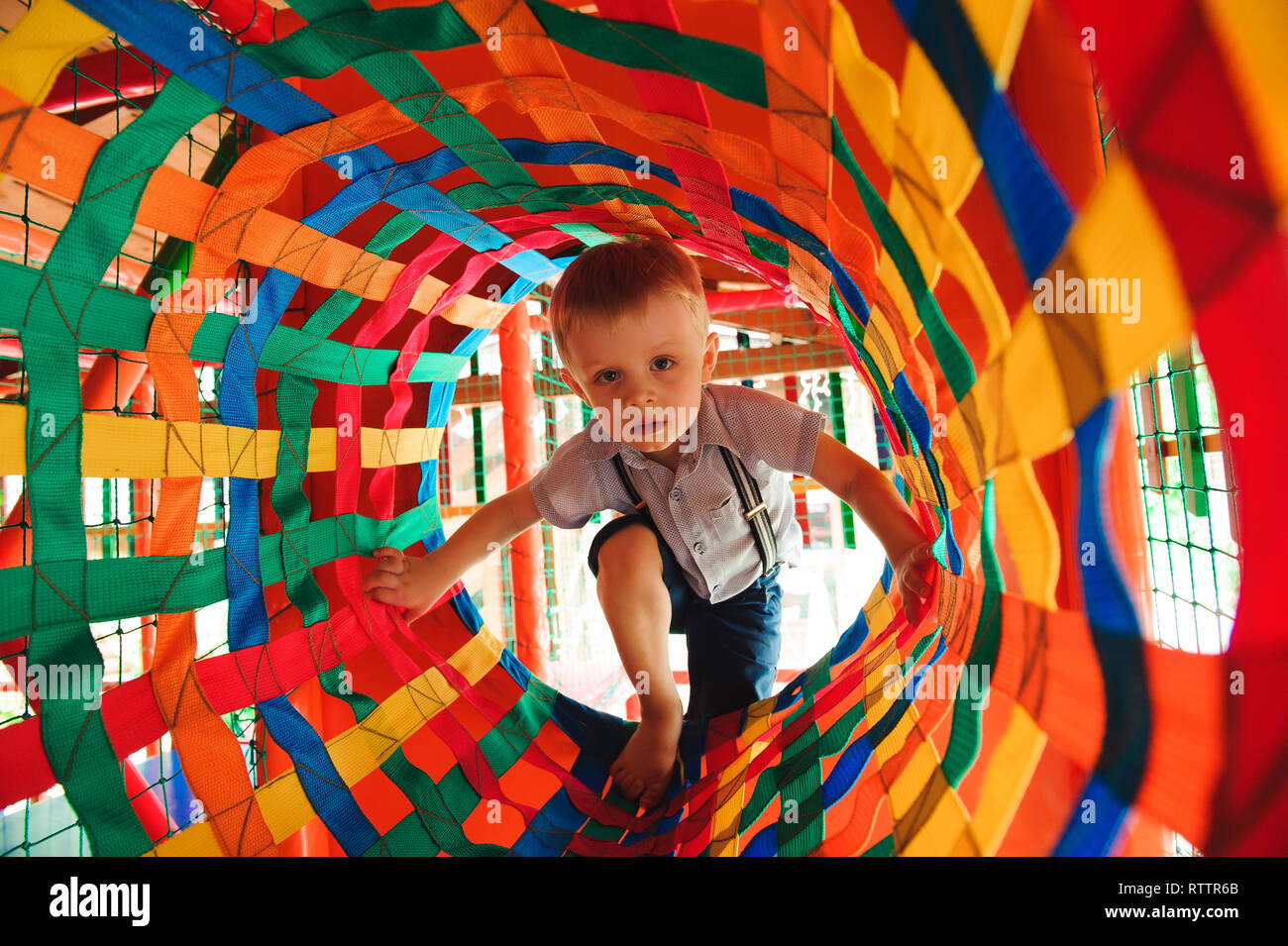 Boy playing on the playground, in the children's maze Stock Photo - Alamy
