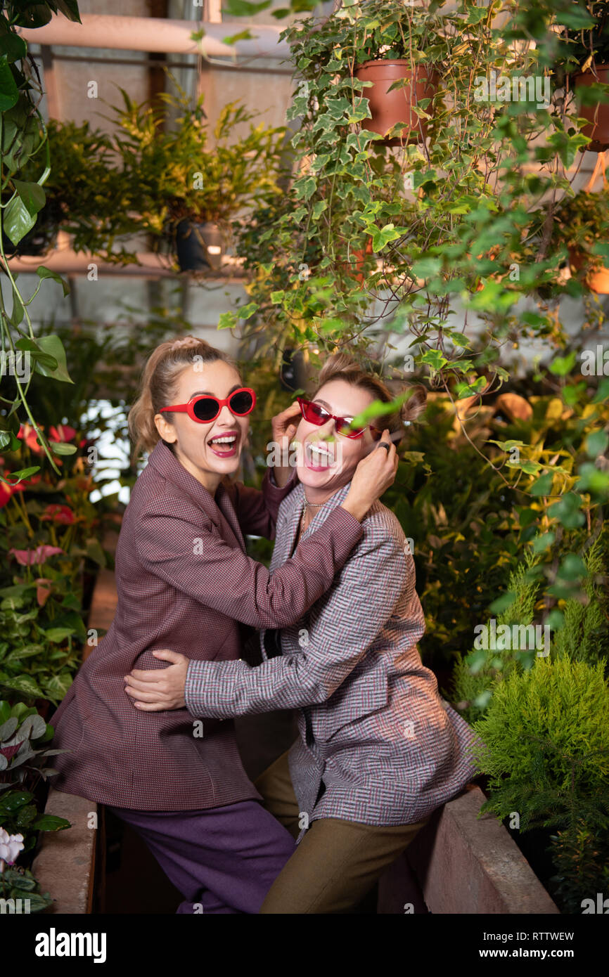Joyful positive nice women having fun together Stock Photo - Alamy
