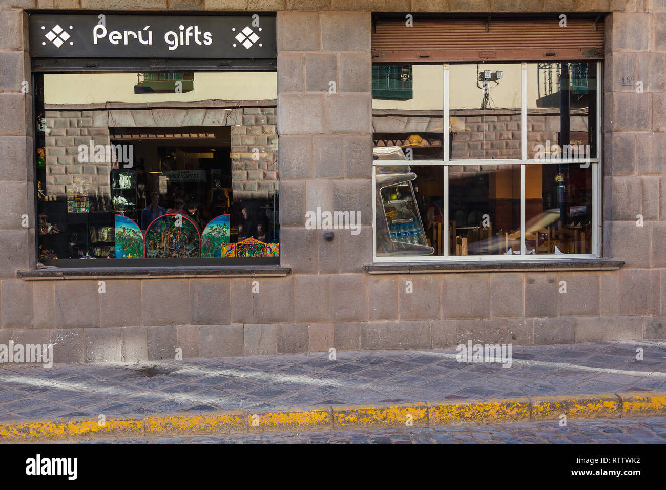 Cusco, Peru, July 2018: Many stores occupy spaces that preserve the ...