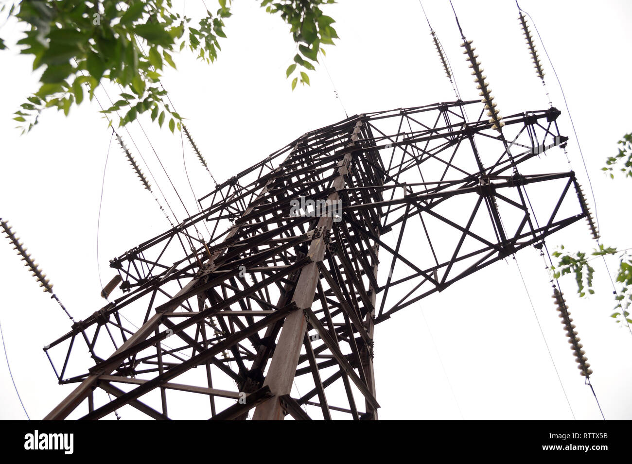Old rusty mast of power lines on the city street Stock Photo - Alamy