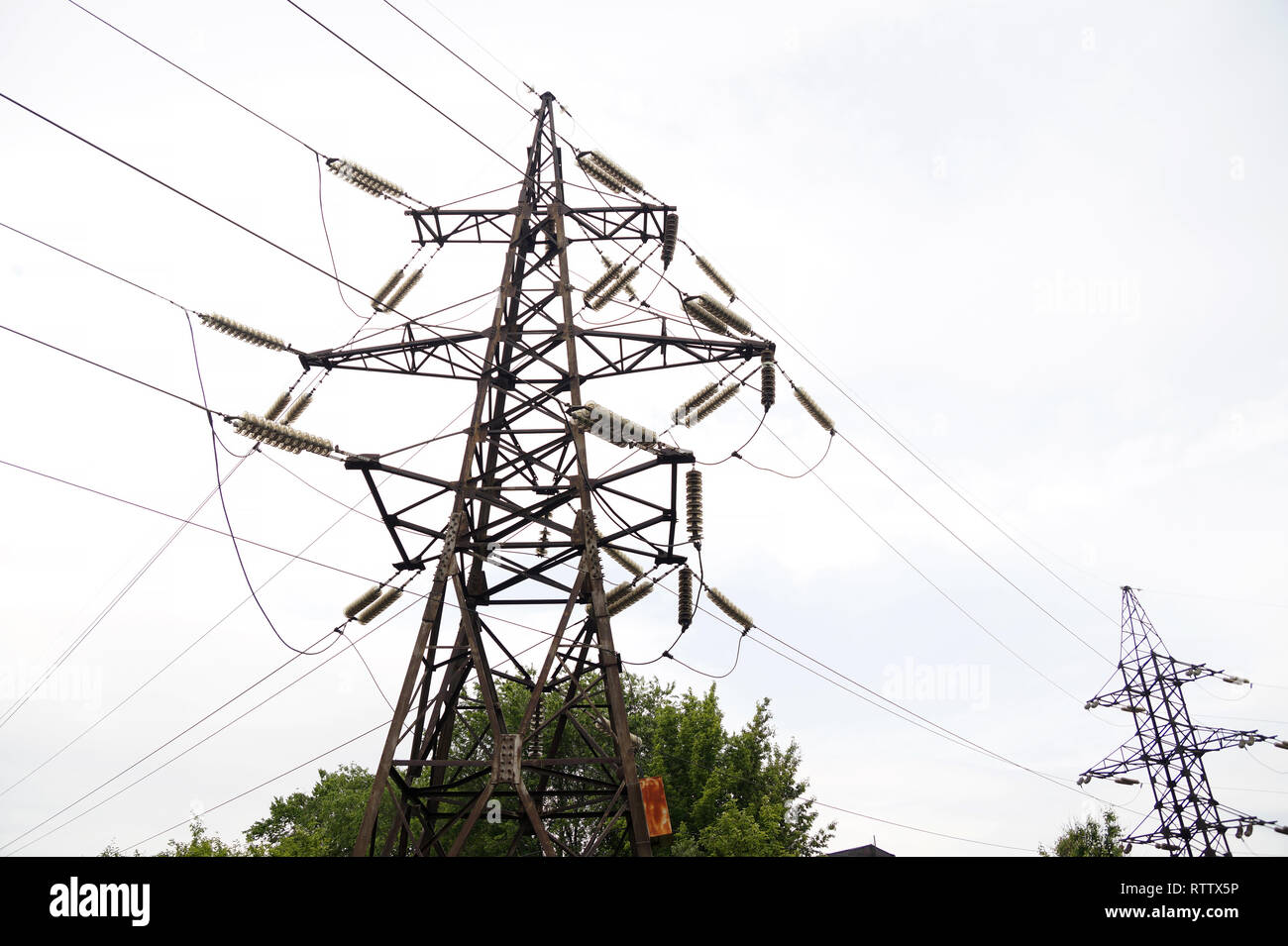 Old rusty mast of power lines on the city street Stock Photo - Alamy