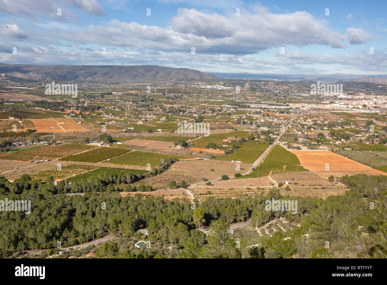 A view of rural farmland area from mountains in Spain. Small town in ...