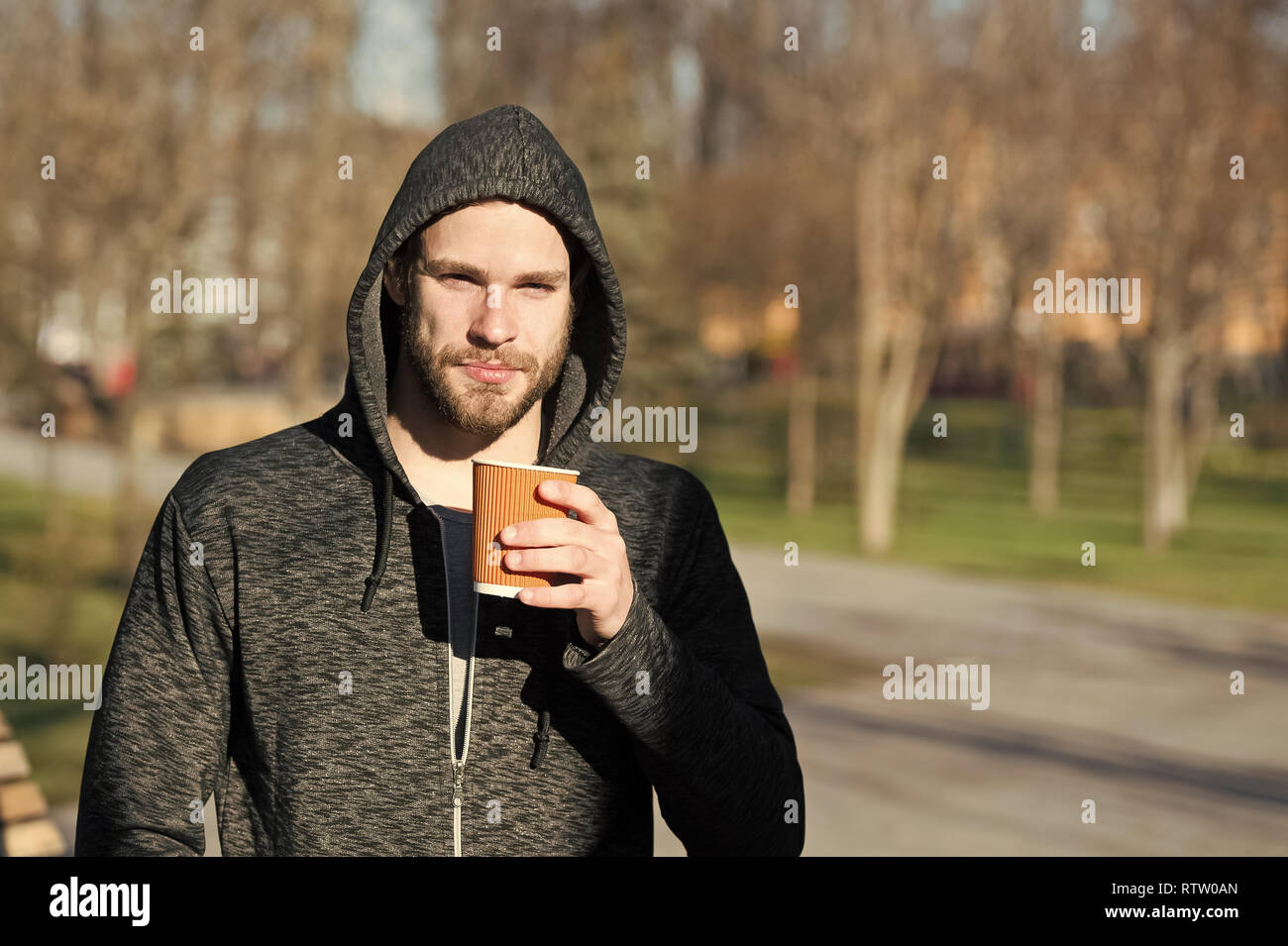 But first coffee. Man morning jog drinks coffee urban background ...