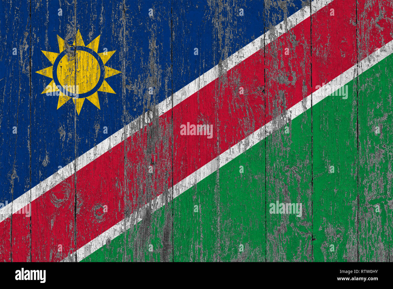 Flag of Namibia painted on worn out wooden texture background Stock ...