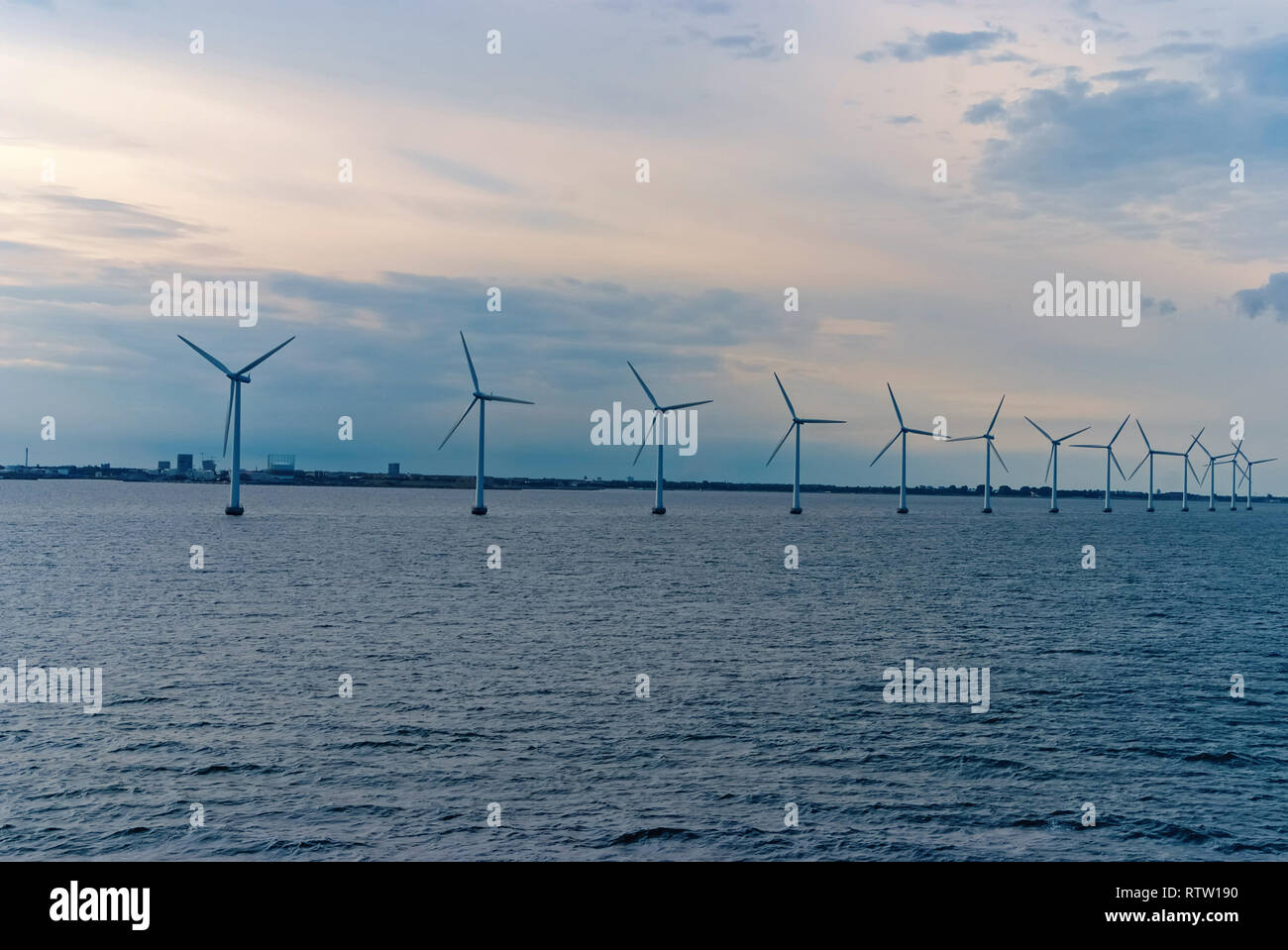 Wind turbines in sea in Copenhagen, Denmark. Offshore wind farm for ...