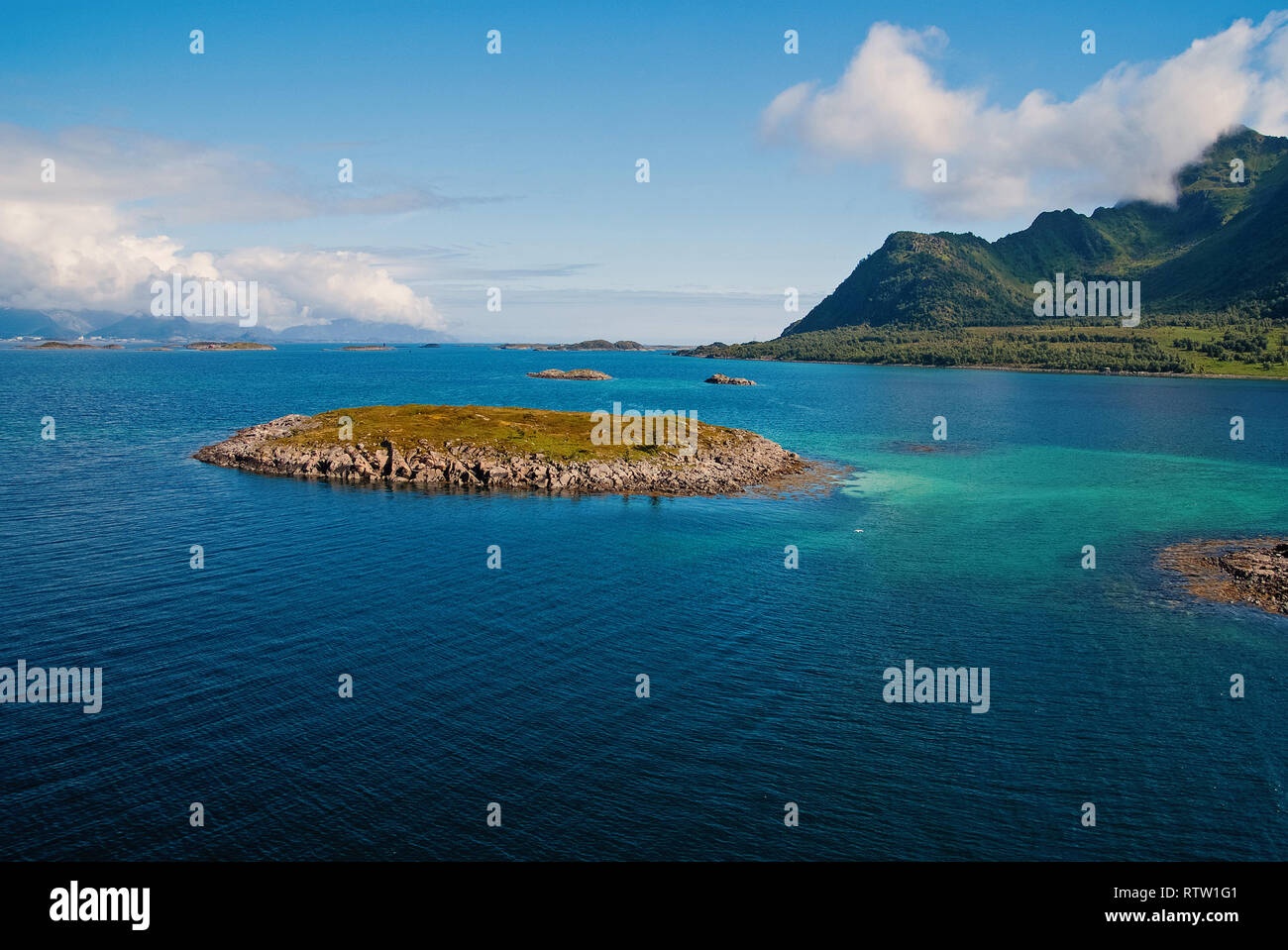 Discover world. Round world cruise. Island stony surrounded idyllic sea ...