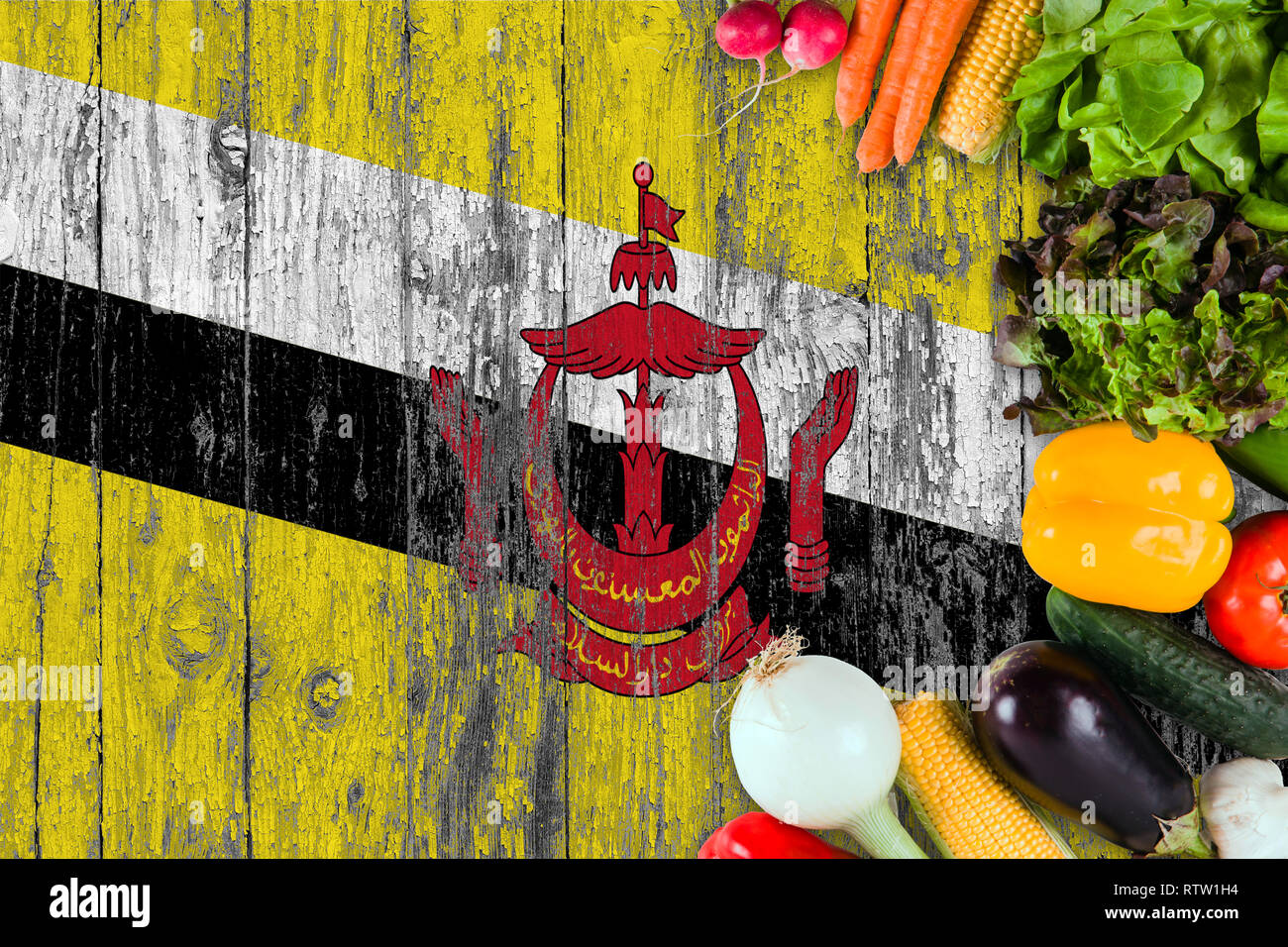Fresh vegetables from Brunei on table. Cooking concept on wooden flag ...