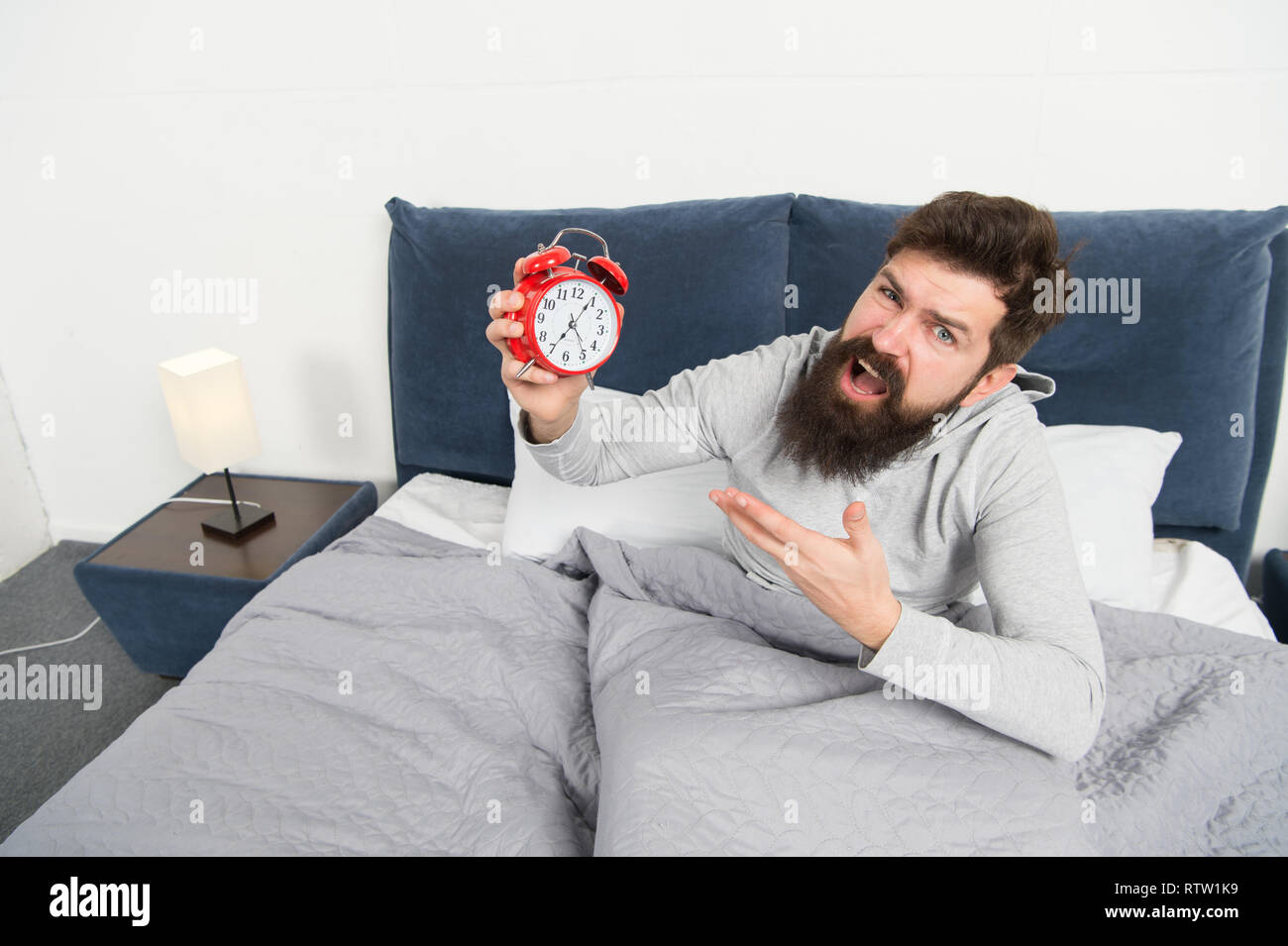 Get up early. Tips for waking up early. Man bearded hipster sleepy face ...