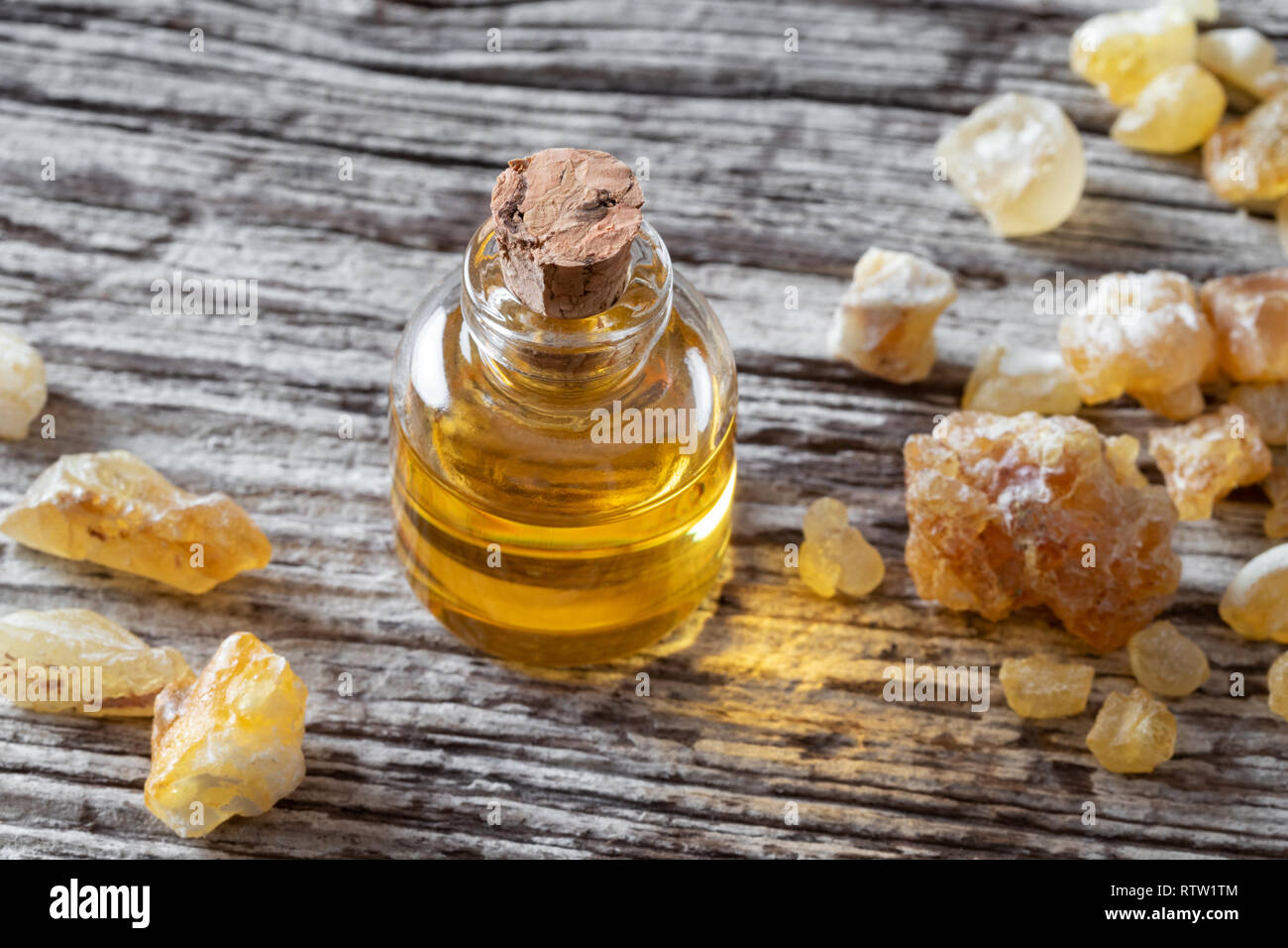 A bottle of essential oil with frankincense resin Stock Photo - Alamy