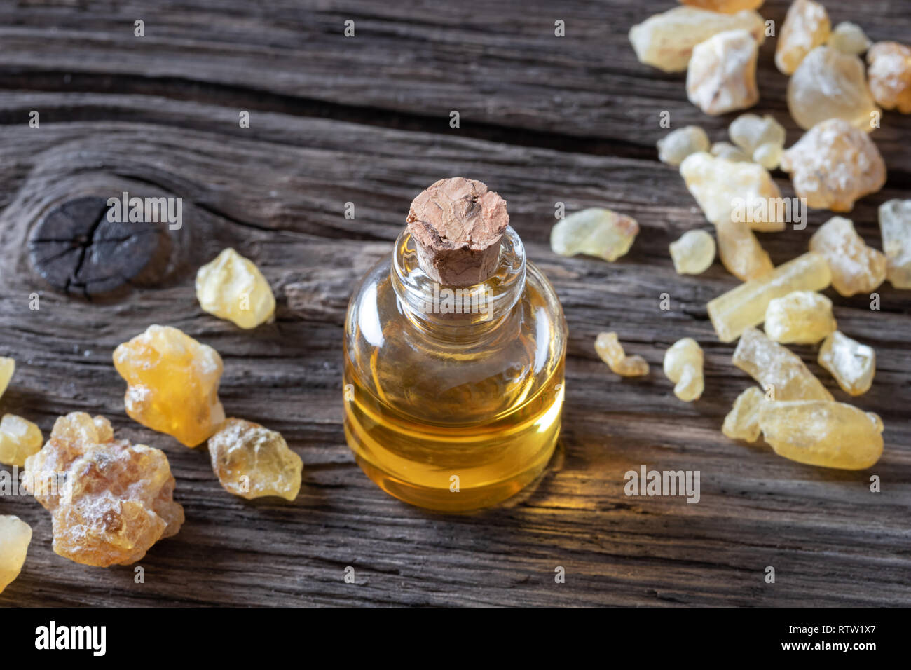 A bottle of essential oil with frankincense resin Stock Photo - Alamy