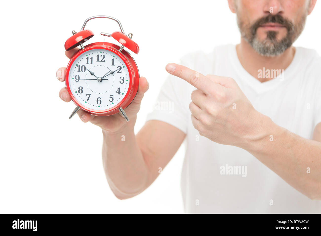 Check time. Man hold alarm clock in hand. Guy bearded mature man worry ...