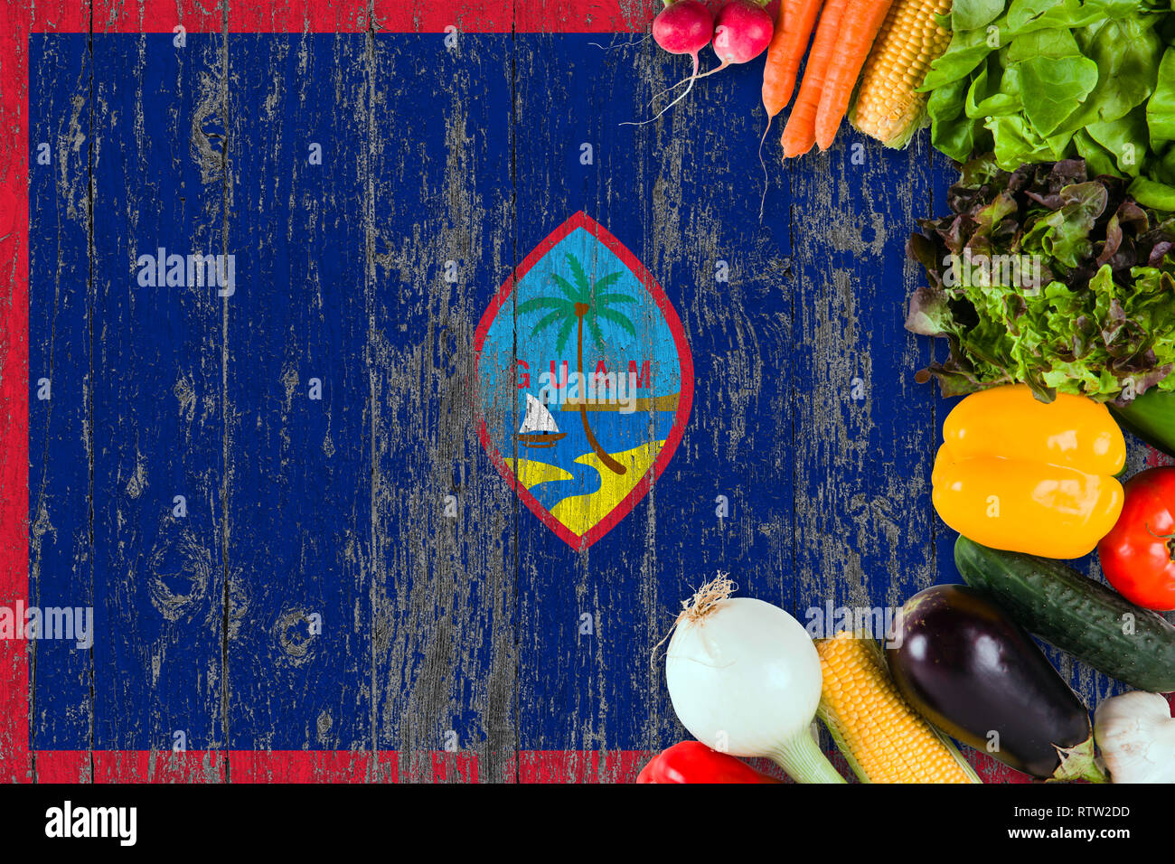 Fresh vegetables from Guam on table. Cooking concept on wooden flag ...
