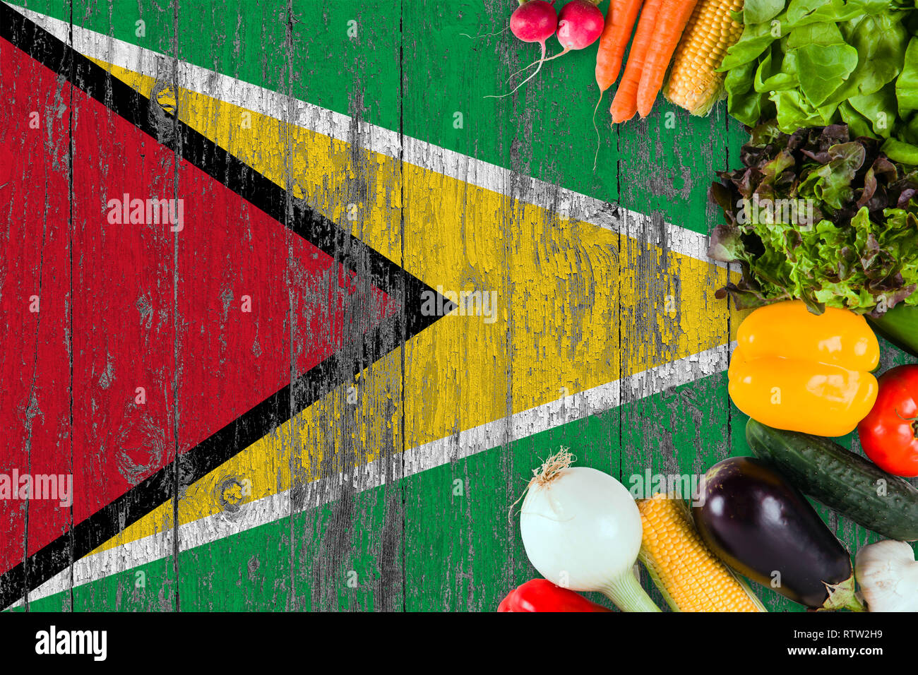 Fresh vegetables from Guyana on table. Cooking concept on wooden flag ...