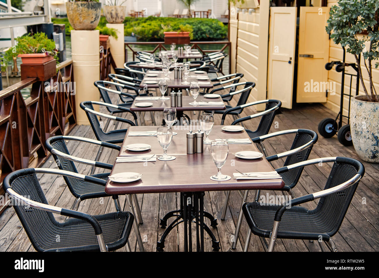 Terrace with tables, chairs and cutlery in philipsburg, sint maarten ...