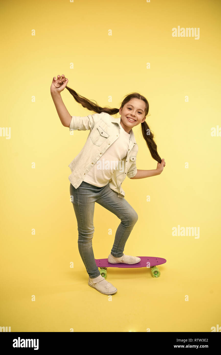 Brunette Girl Riding Penny Board