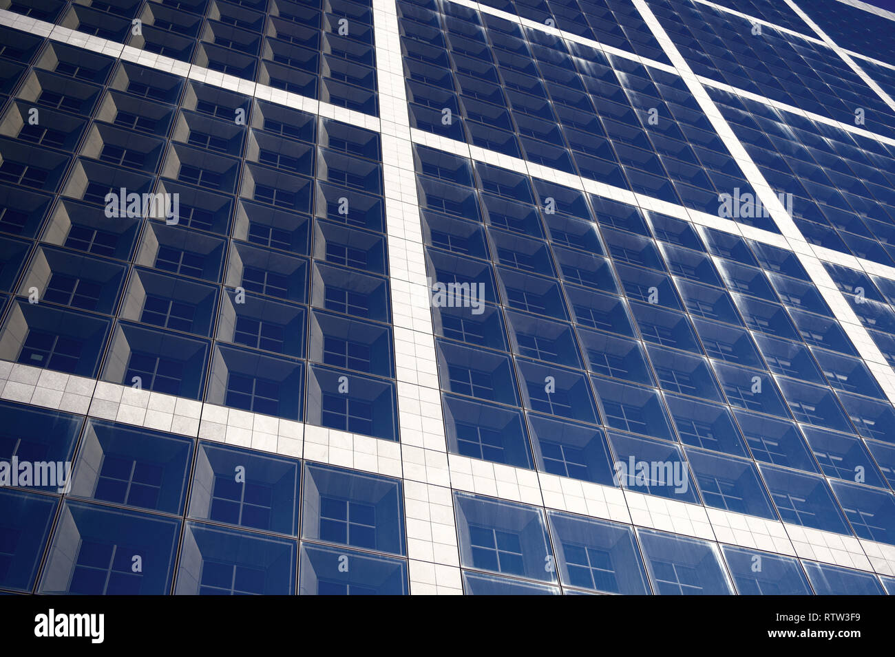 Building facade with blue glass windows. Modern architecture and ...
