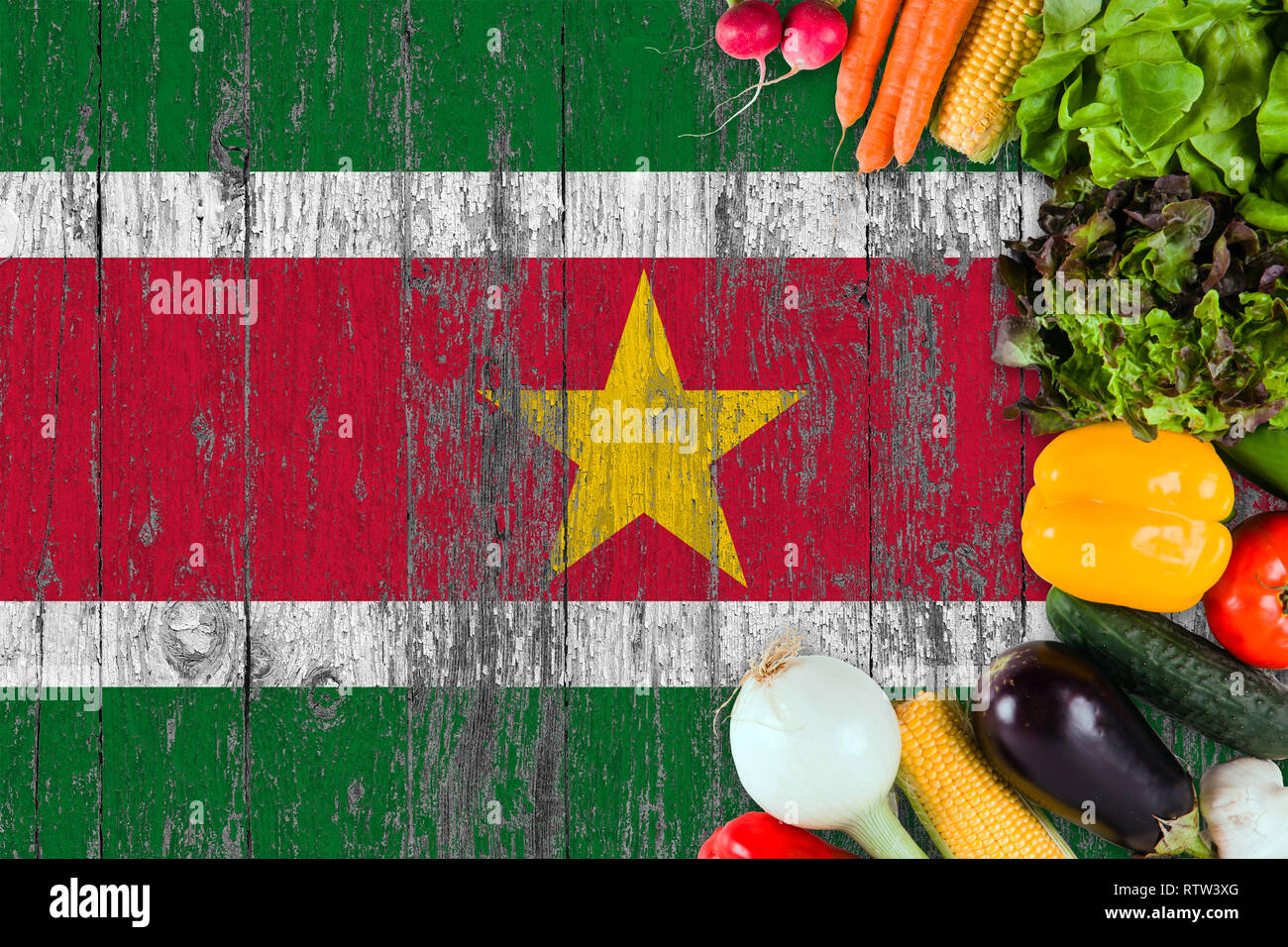 Fresh vegetables from Suriname on table. Cooking concept on wooden flag ...