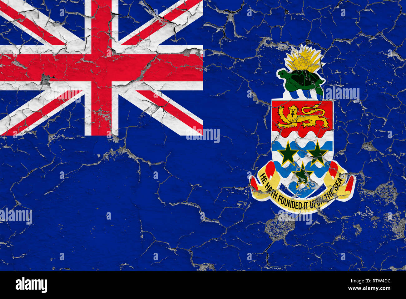 Flag of Cayman Islands painted on cracked dirty wall. National pattern ...