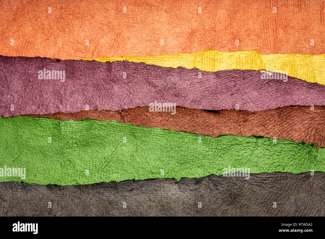 abstract landscape created with sheets of textured colorful handmade ...