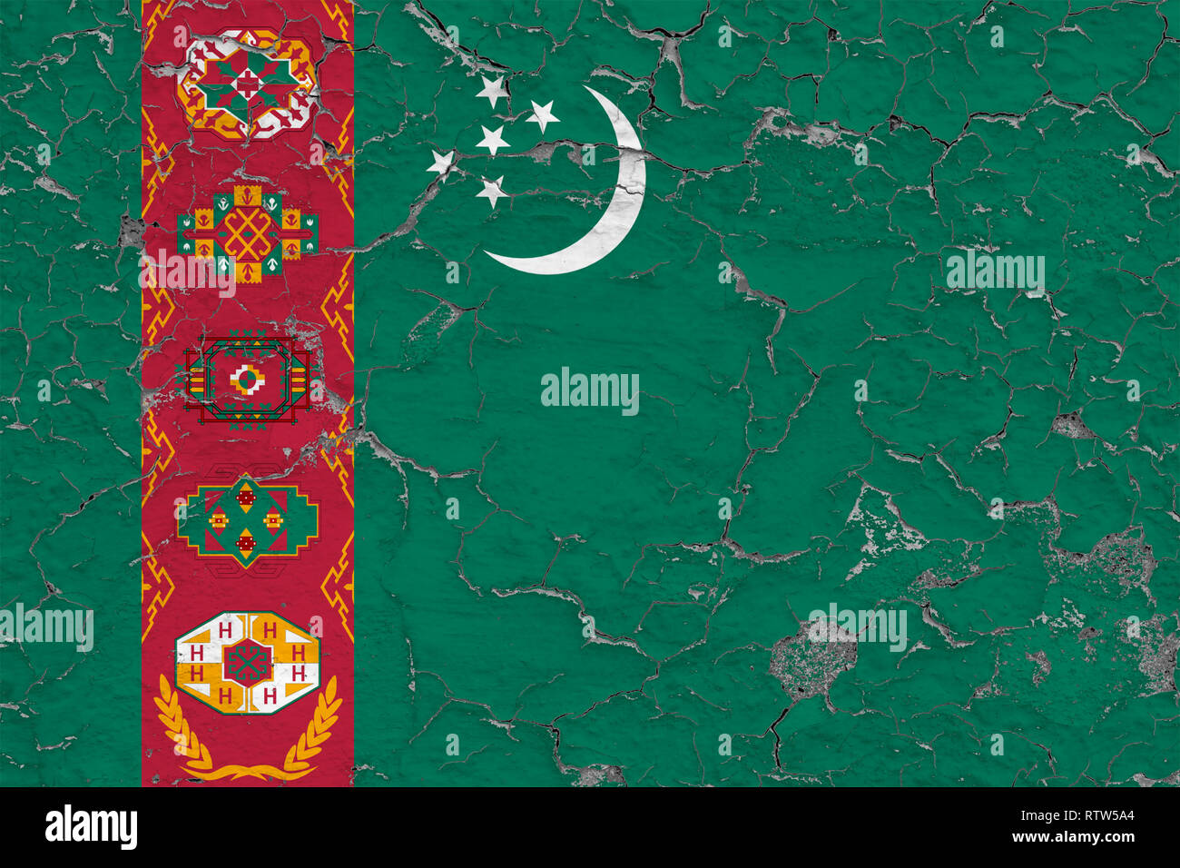 Flag of Turkmenistan painted on cracked dirty wall. National pattern on ...