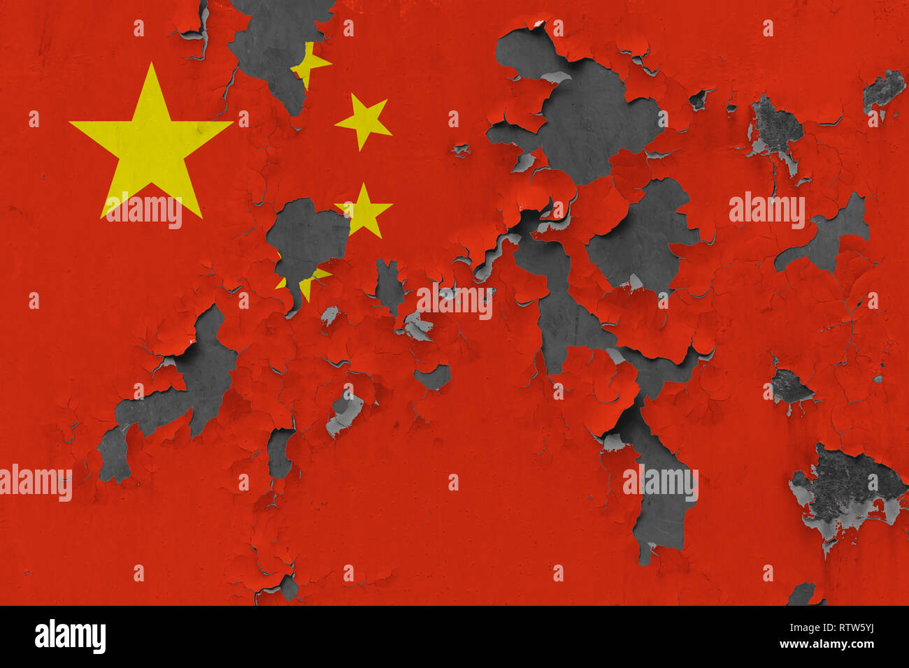 Close up grungy, damaged and weathered China flag on wall peeling off ...