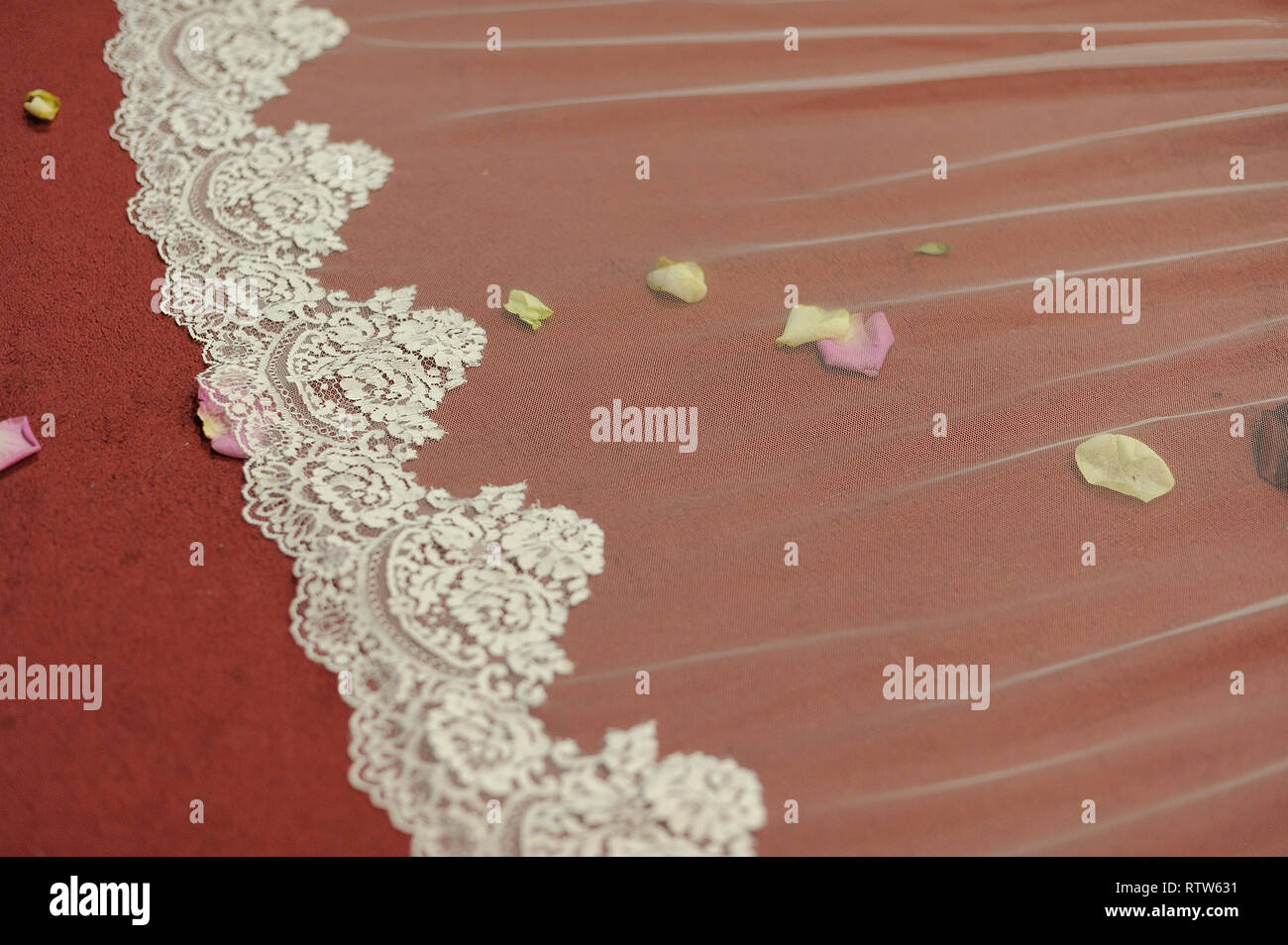 tail of wedding dress on red carpet Stock Photo - Alamy