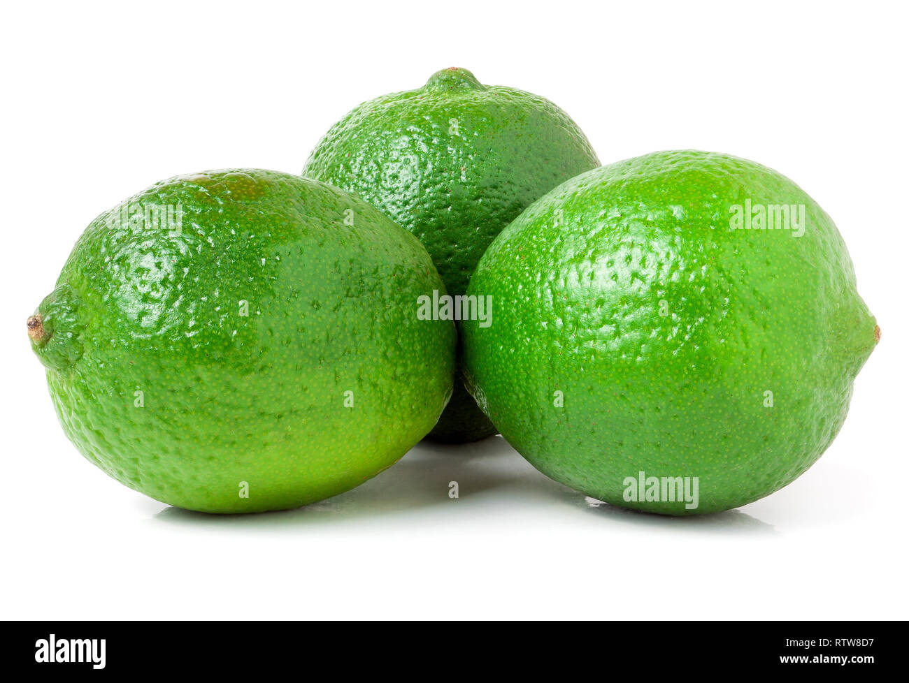 three lime isolated on white background close up Stock Photo - Alamy