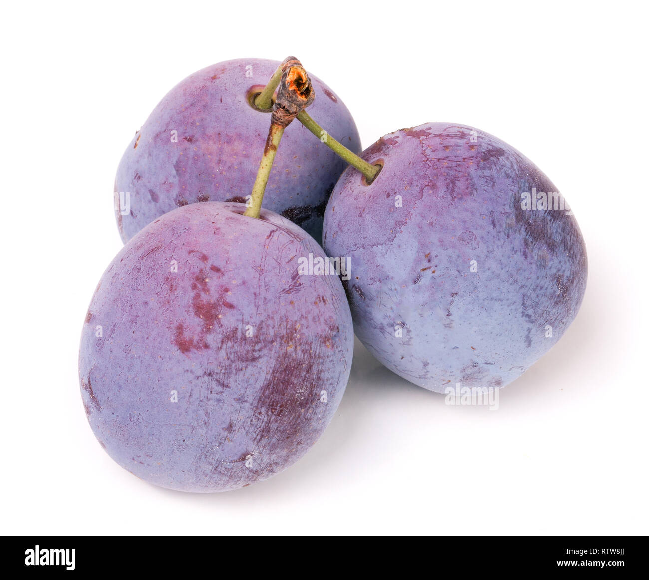 three plums isolated on white background Stock Photo - Alamy