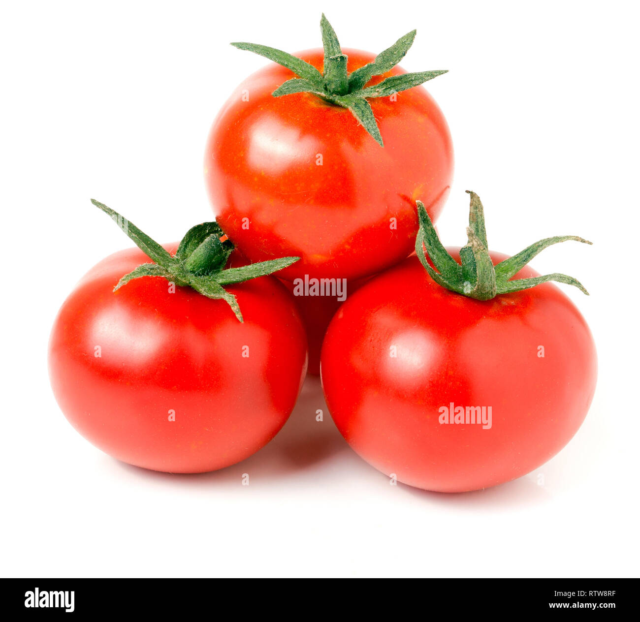 three tomato isolated on a white background Stock Photo - Alamy