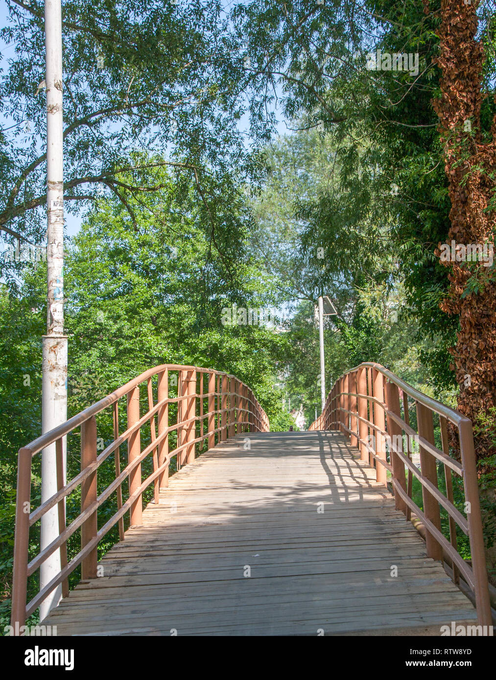 old wooden bridge over the river with a handrail Stock Photo - Alamy