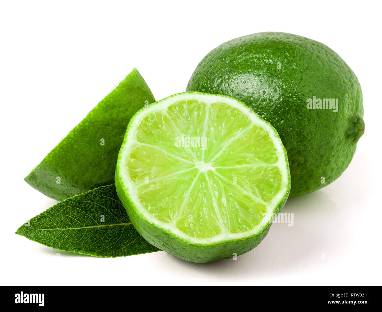 lime with two halves and leaf isolated on white background Stock Photo ...