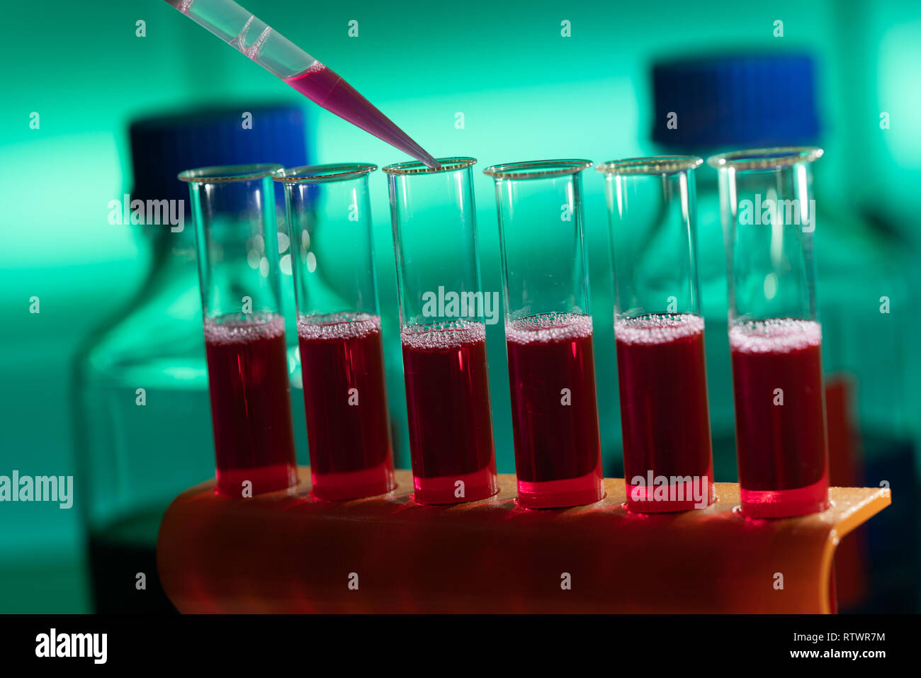 Test tube in rack and pipette media dispenser Stock Photo - Alamy