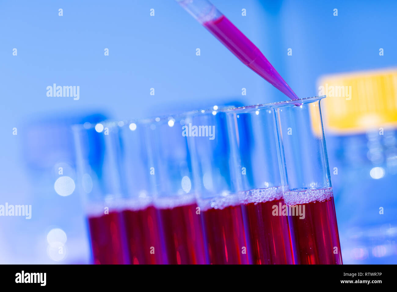 Test tube in rack and pipette media dispenser Stock Photo - Alamy