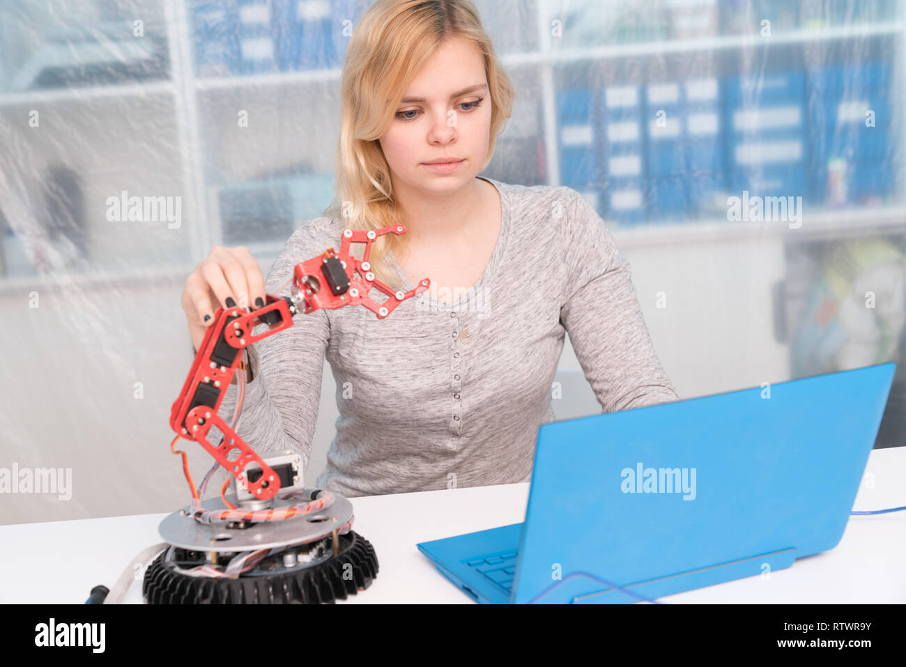 Young attractive female engineer working on robotics project Stock ...