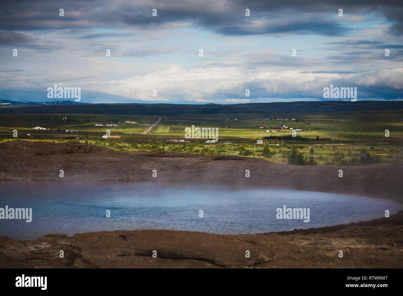 The colorful geyser landscape at the Haukadalur geothermal area, part ...