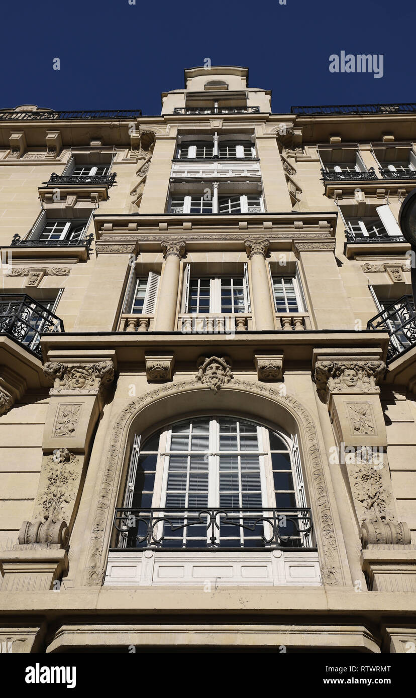 Traditional French house with typical balconies and windows. Paris ...