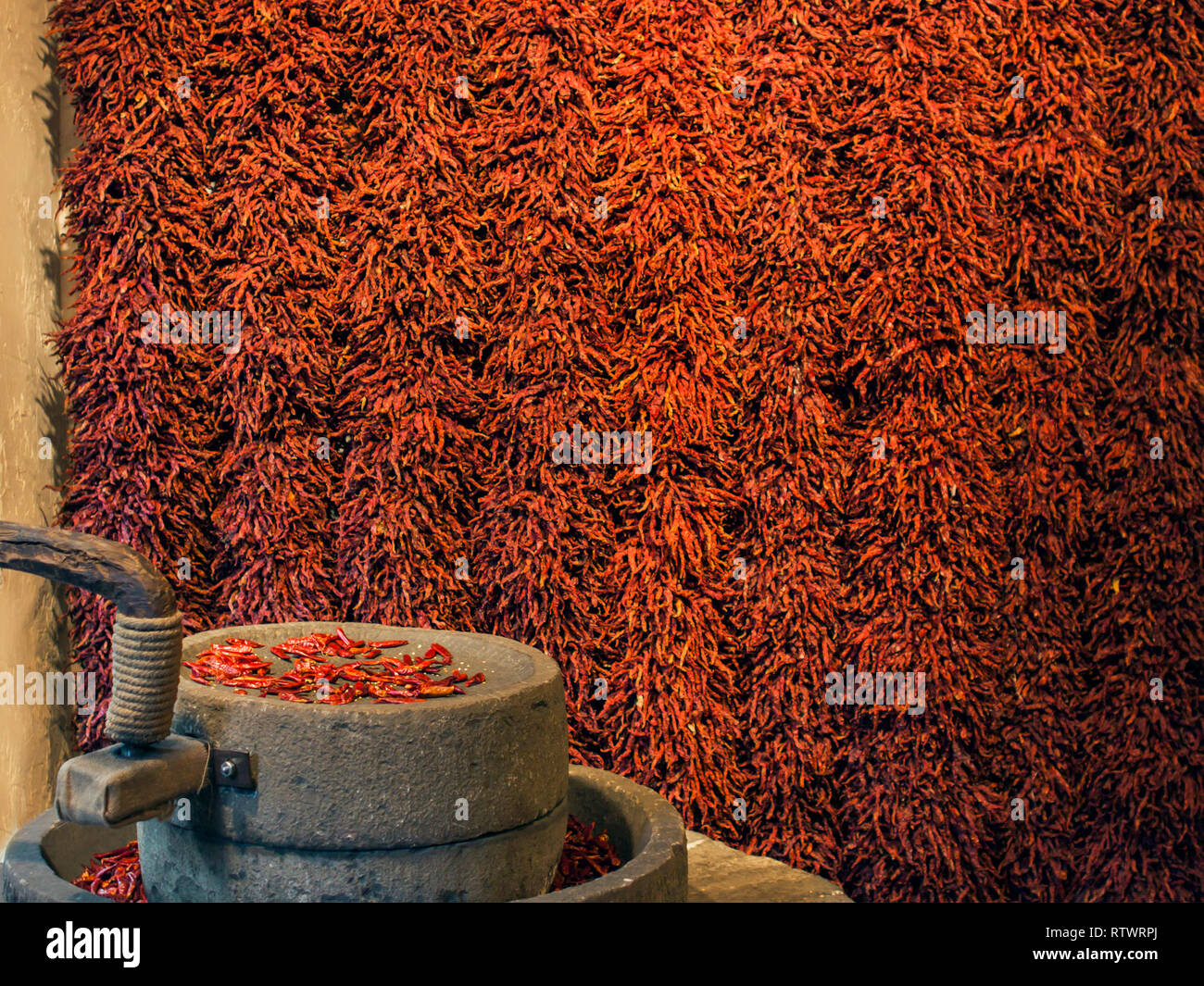 Dried Red Chilli Collected and Hung on the Wall as Decoration. Stone ...