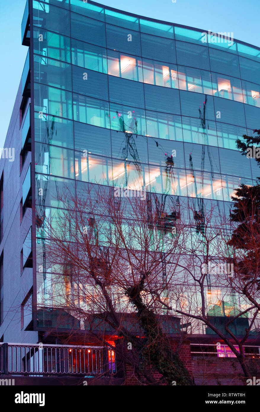 sunset light on the exterior windows of Kings Place, 90 York Way ...
