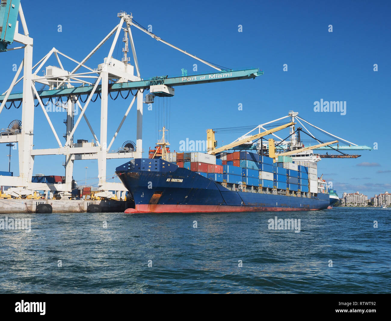 Miami, Florida 03-01-2019 Container ships load cargo containers under ...