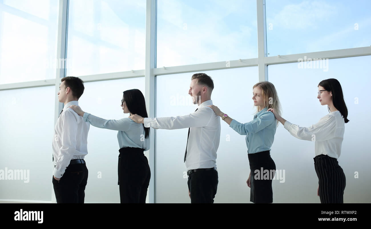 business team standing together near the office window Stock Photo - Alamy