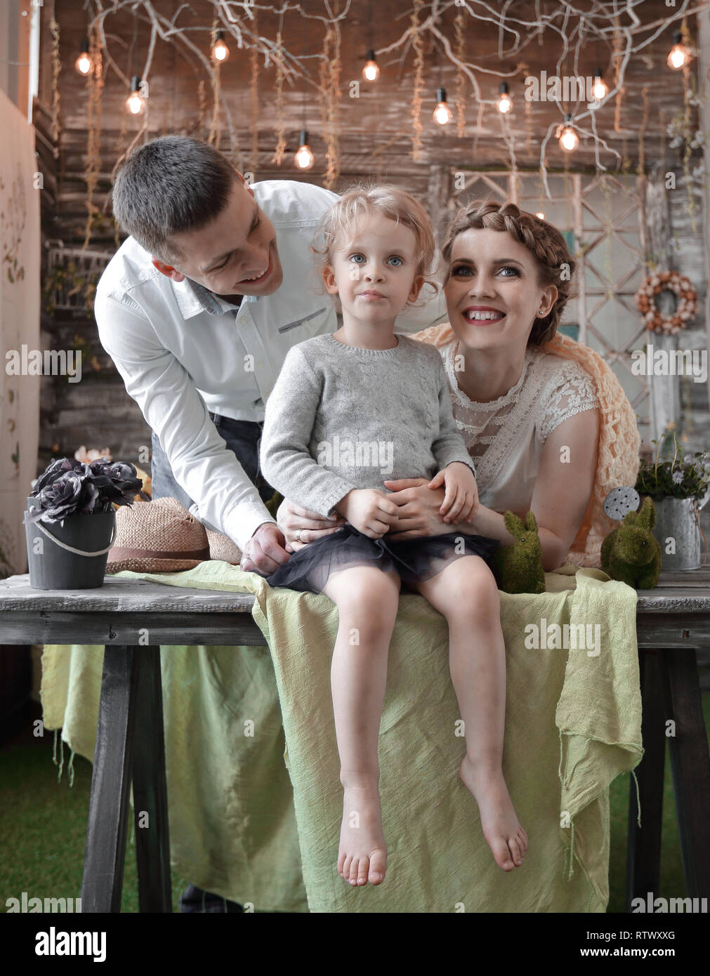 mom ,dad and daughter in the cozy living room Stock Photo - Alamy