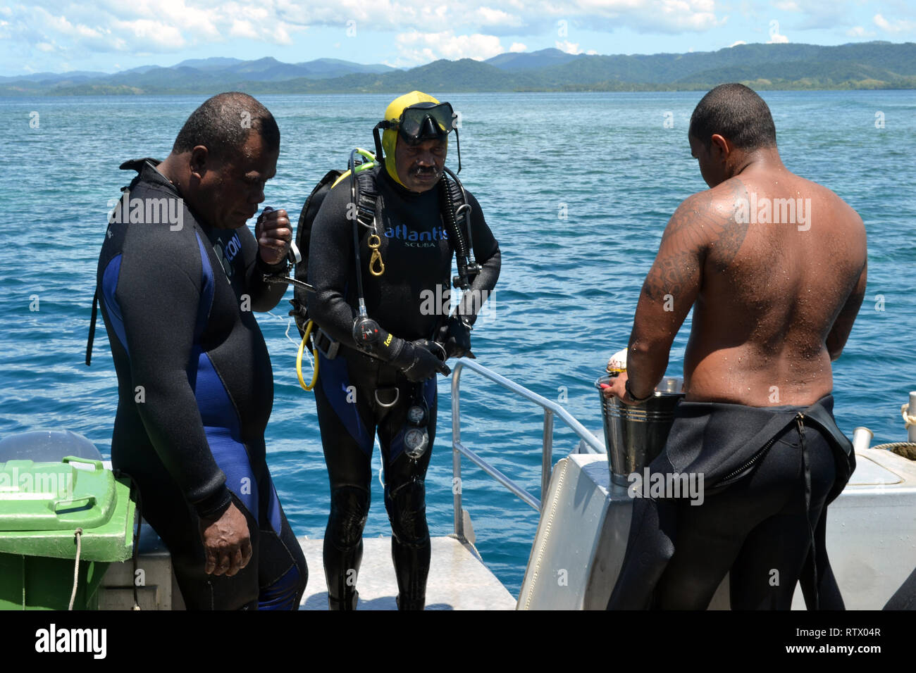 Divers get ready for a dive off Beqa Lagoon, Pacific Harbour, Viti Levu ...