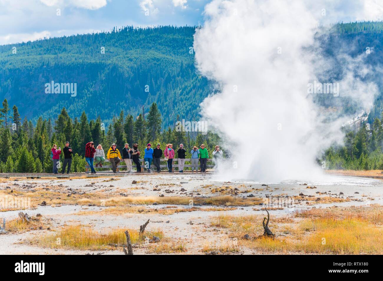 Tourists observe the eruption of the Geyser, Jewel Geyser, Black Sand ...