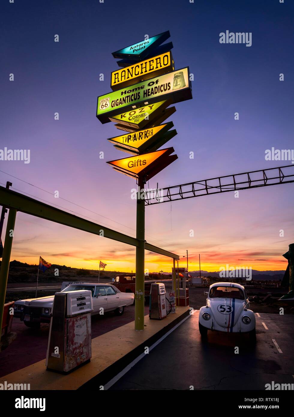 Historic rest stop and gas station with vintage cars, at sunset ...