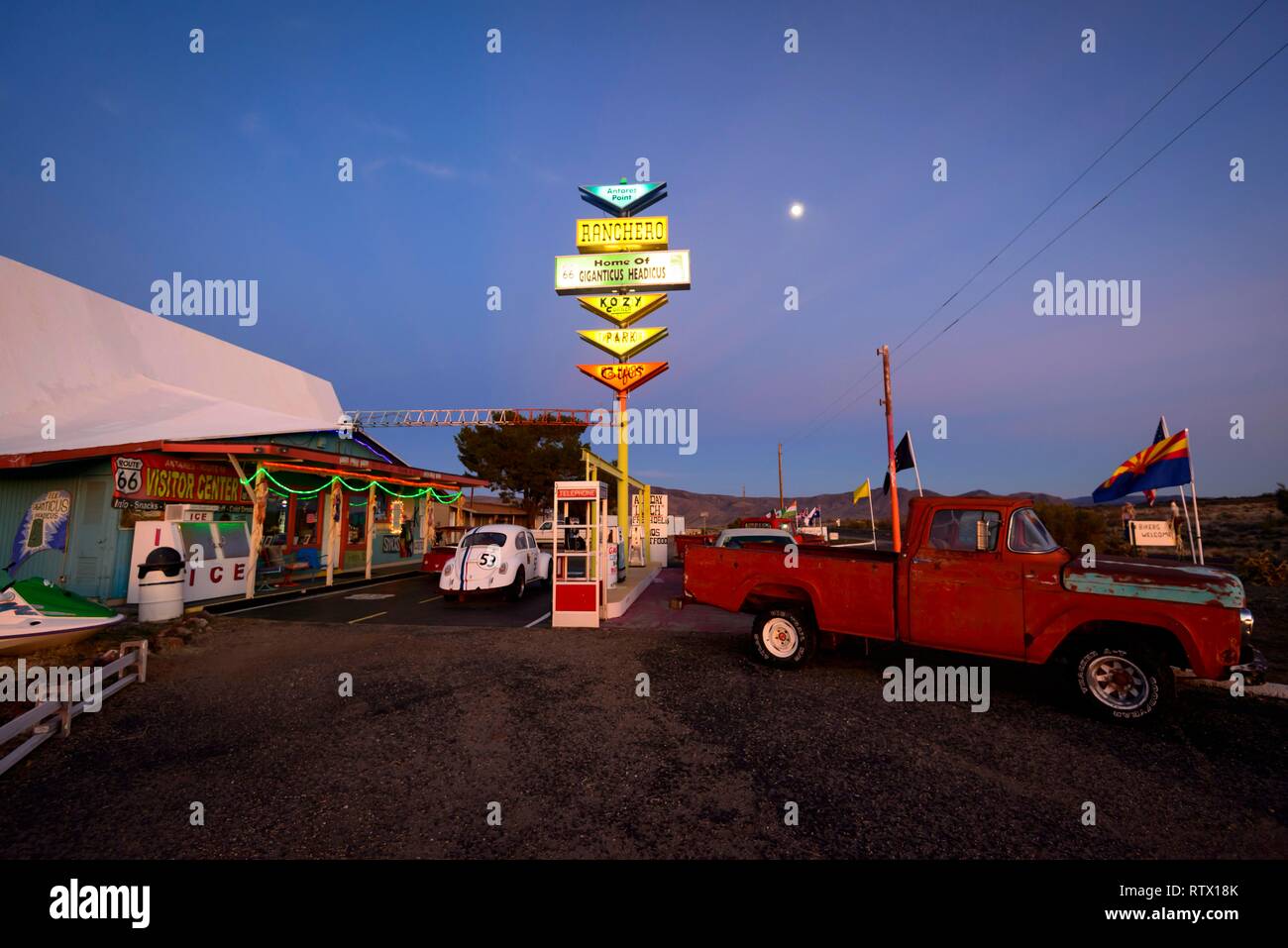 Historic rest stop and gas station with vintage cars, at sunset ...