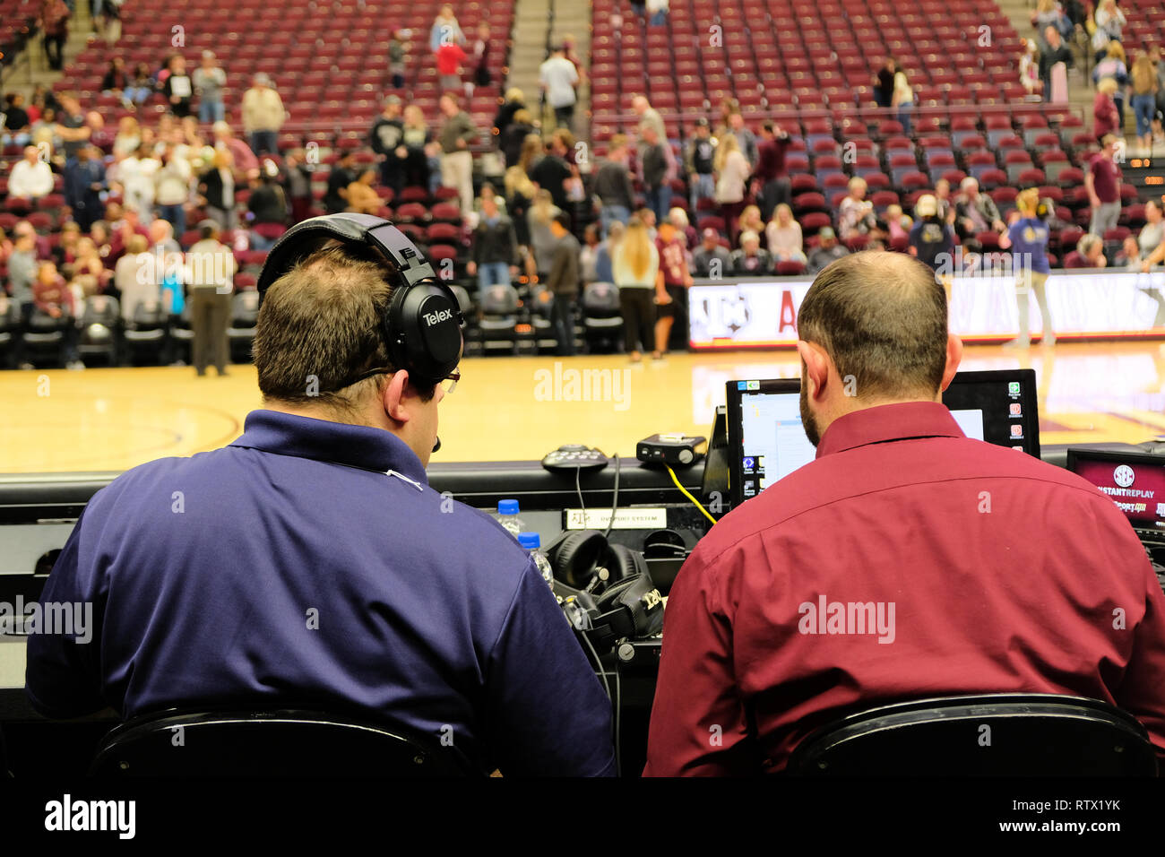 Sideline officials; NCAA basketball game; time, clock, and score ...