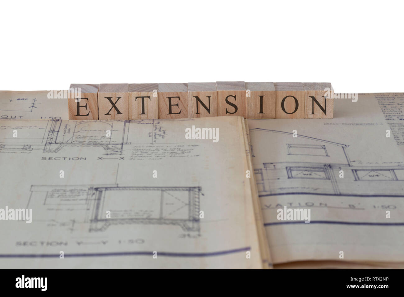 Extension written on wooden blocks on house extension building plans ...