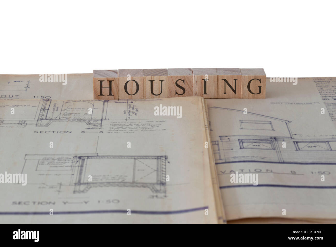 Housing written on wooden blocks on house extension building plans ...