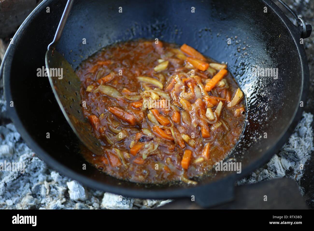 barbecue, roast beef, on a fire in a special pan, stew in nature Stock ...