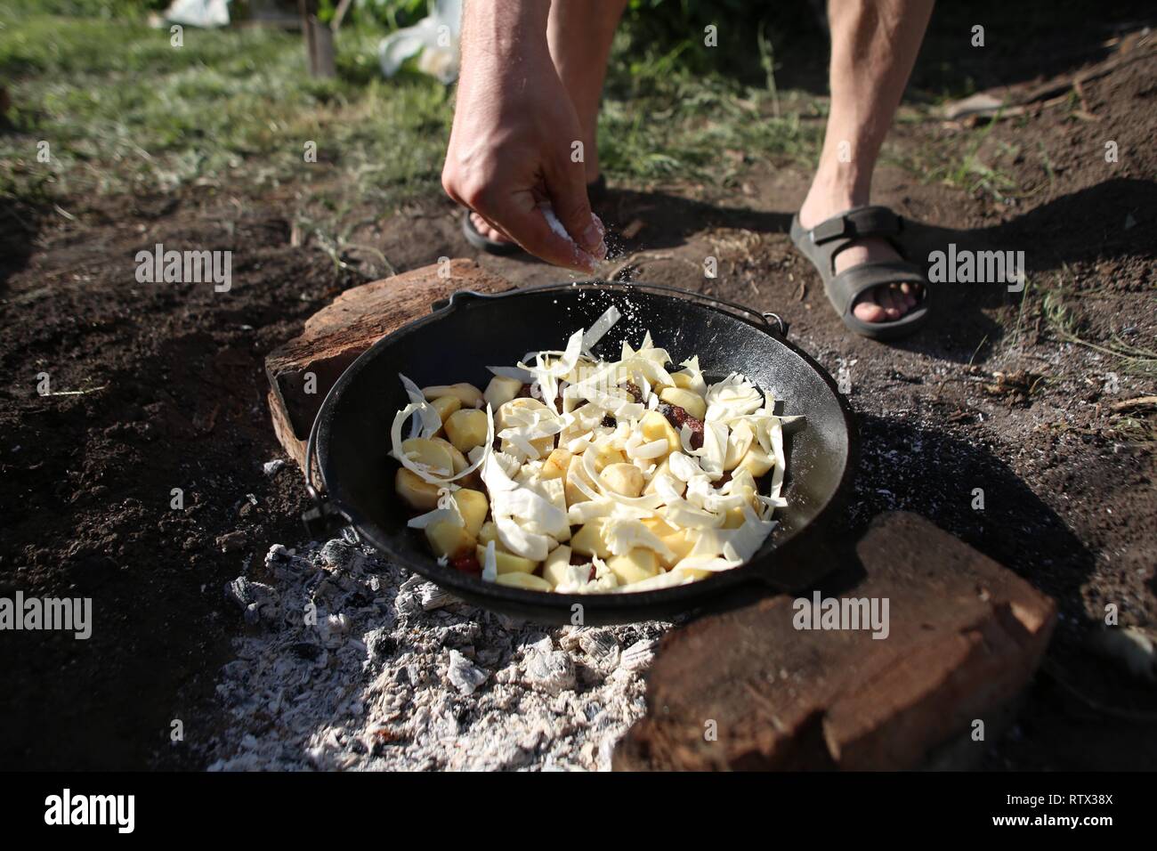 barbecue, roast beef, on a fire in a special pan, stew in nature Stock ...
